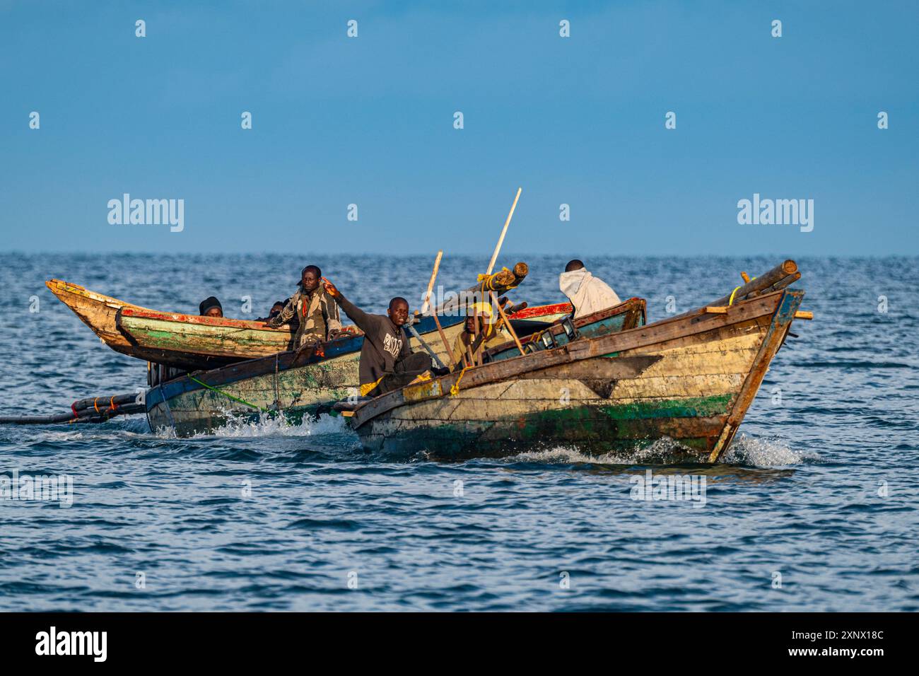 Wooden fishing boats and fishermen, Kigoma, Lake Tanganyika, Tanzania ...