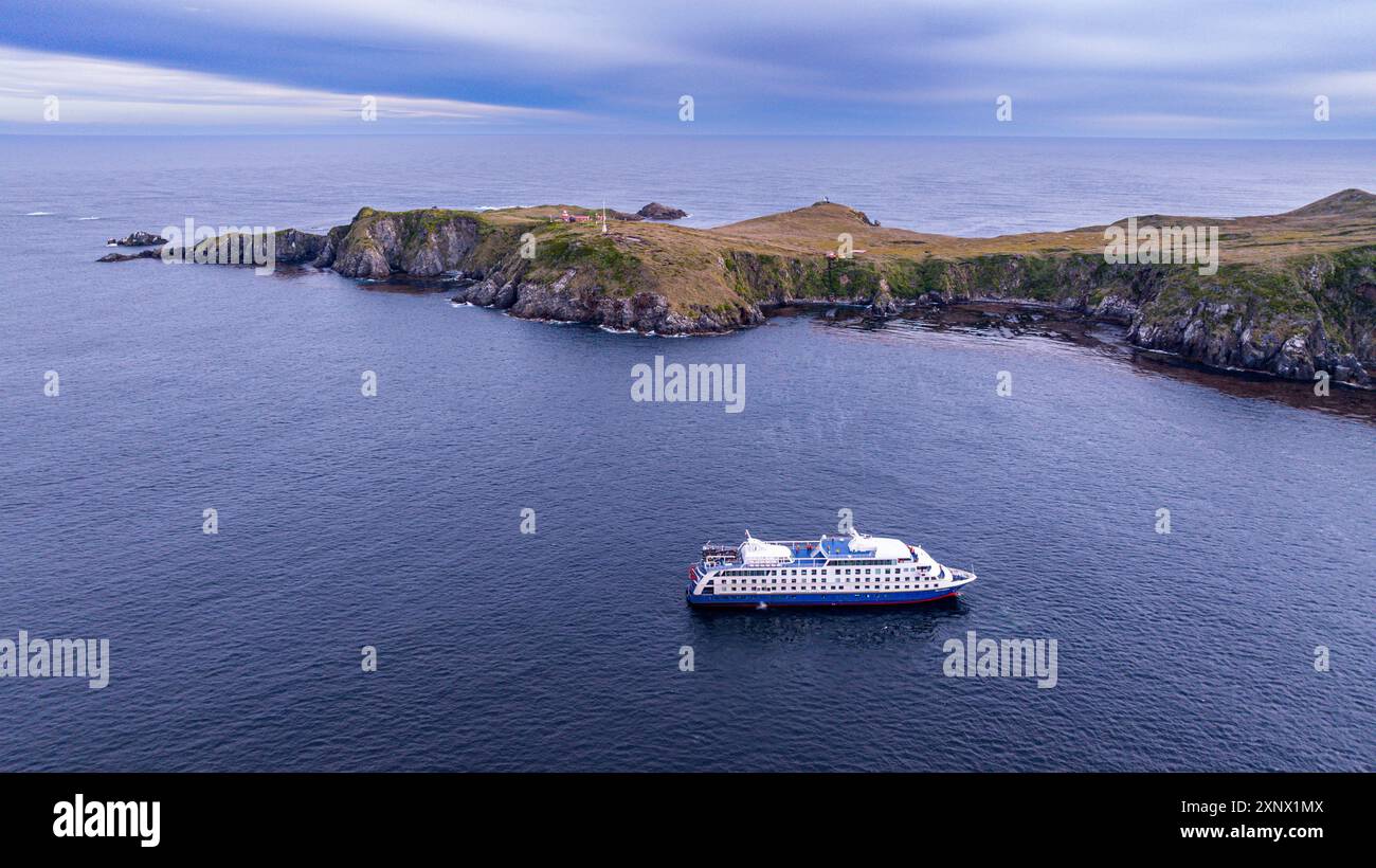 Aerial of a cruise ship anchoring at Cape Horn, southern most point in ...