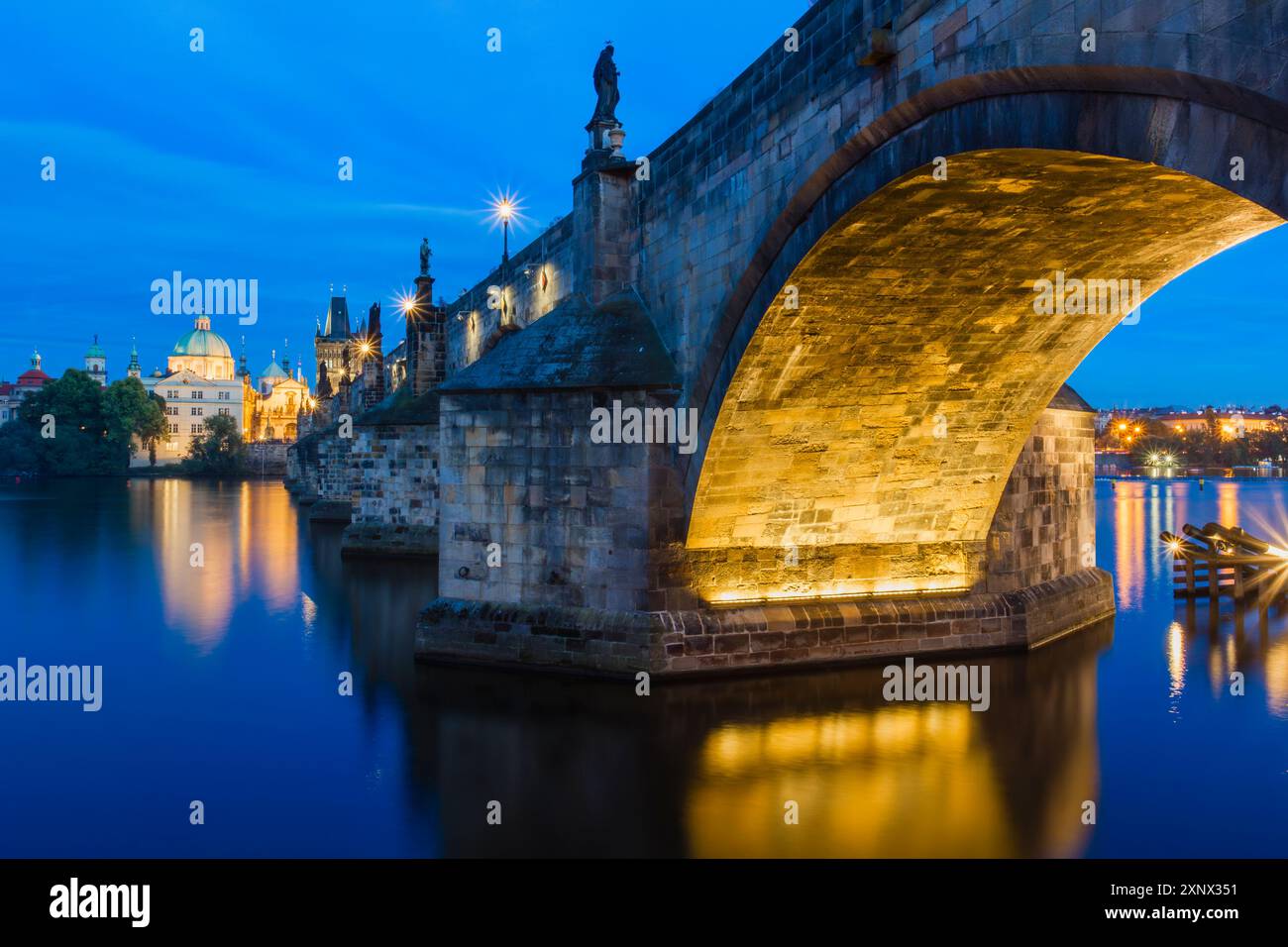 Illuminated arch of Charles Bridge at twilight, UNESCO World Heritage ...