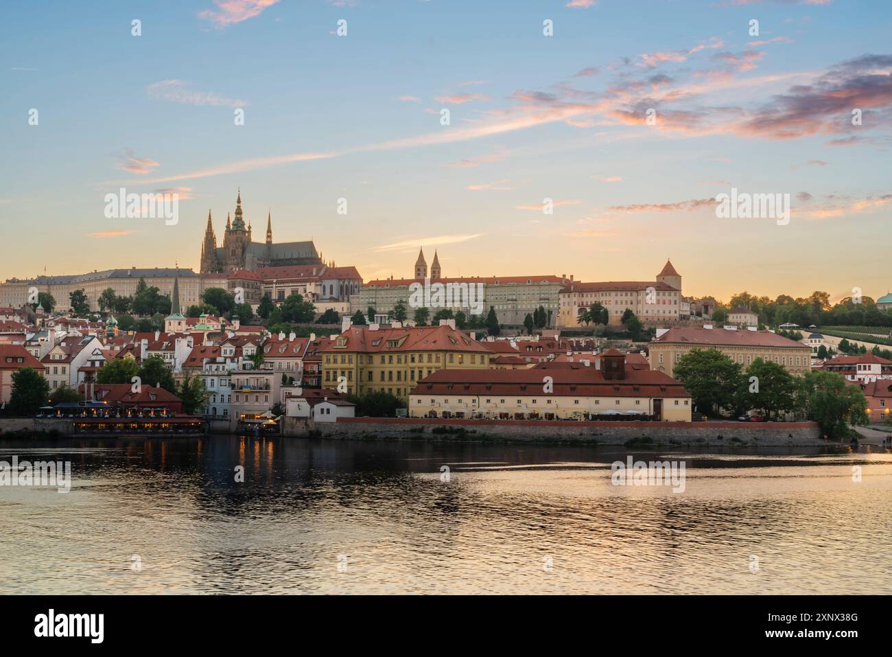 Prague Castle rising above Vltava River at sunset, UNESCO World ...