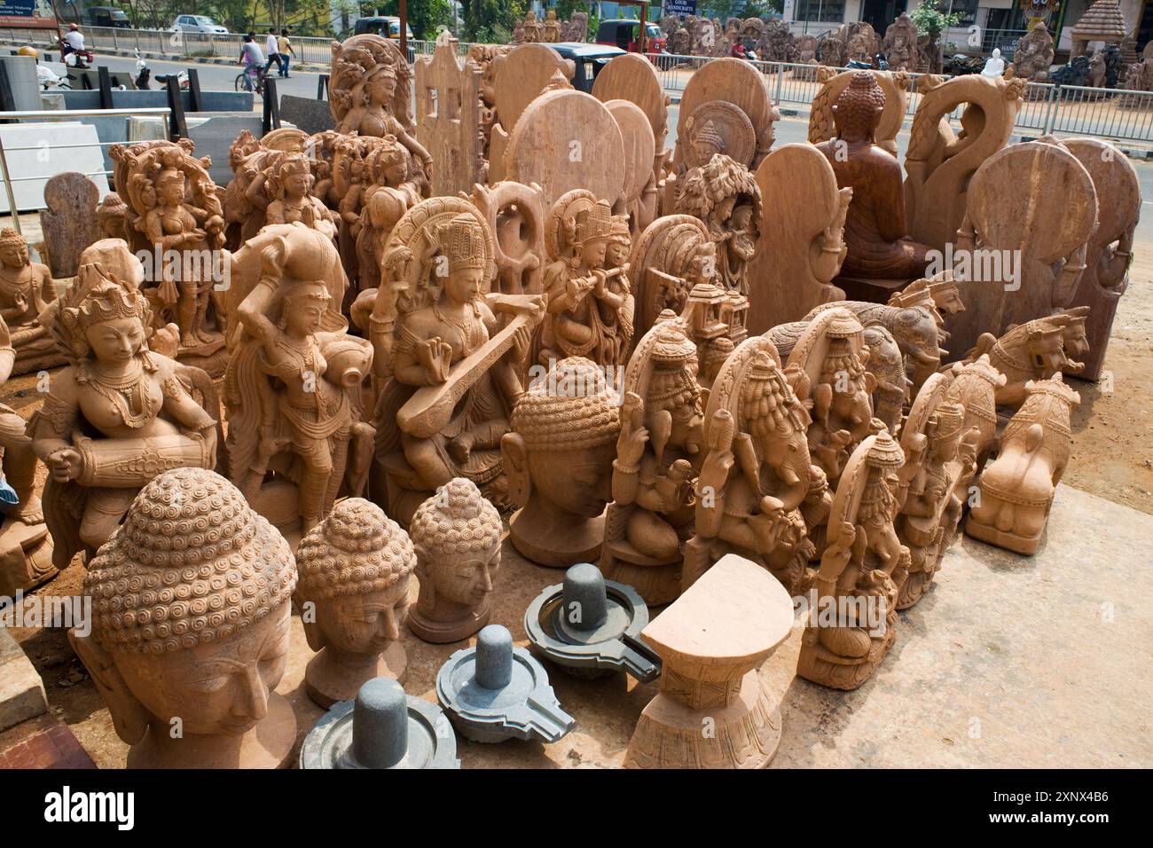 Statues of Hindu deities on view in front of a roadside trader's shop ...