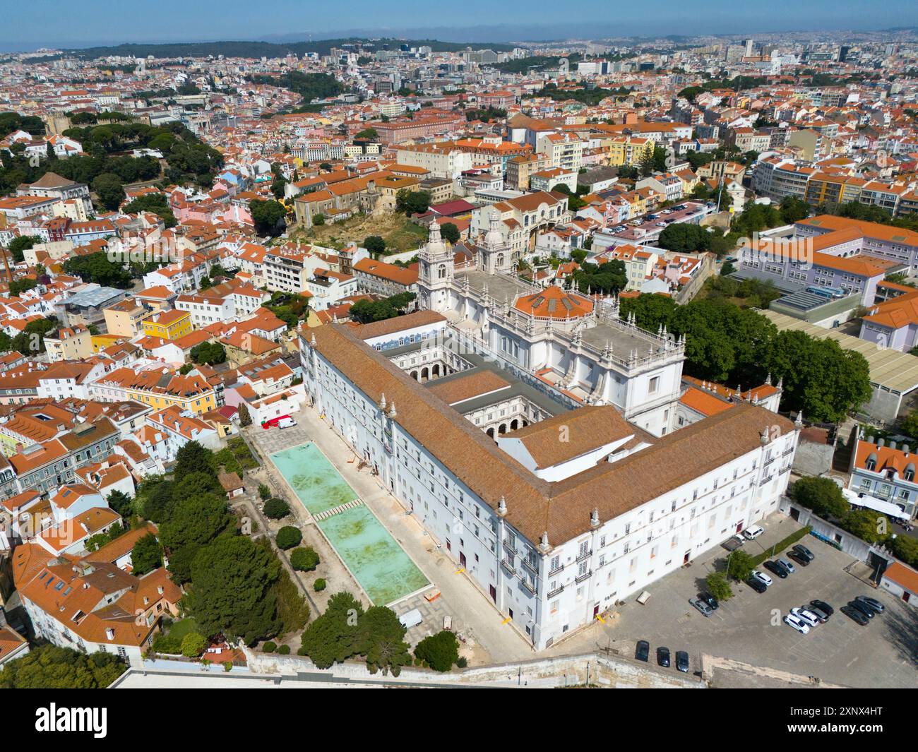 Monastery building in the middle of an urban landscape with red roofs ...