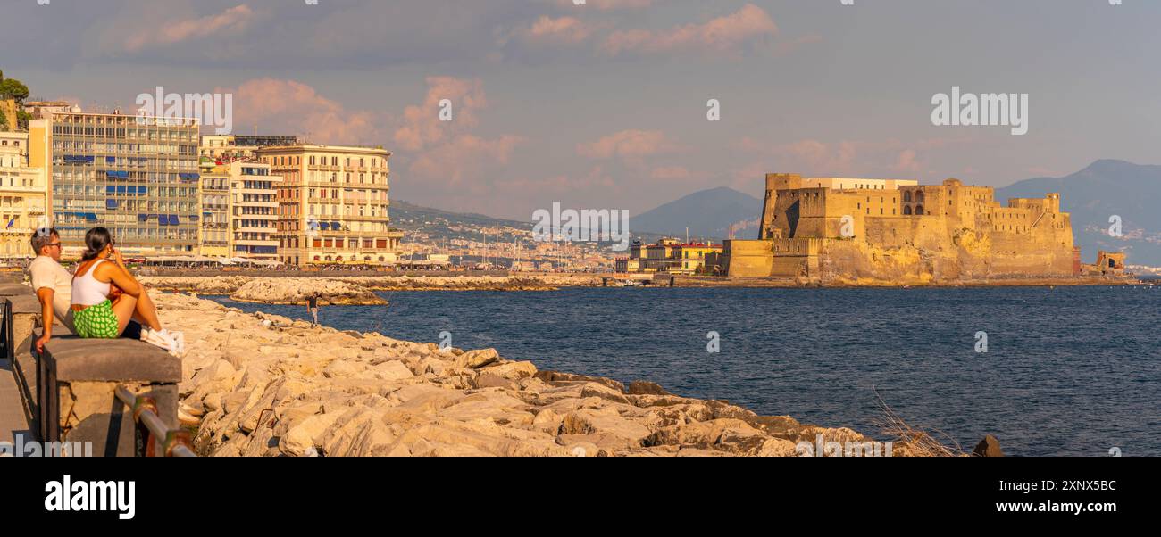 View of pastel coloured architecture and couple looking at Ovo Castle ...