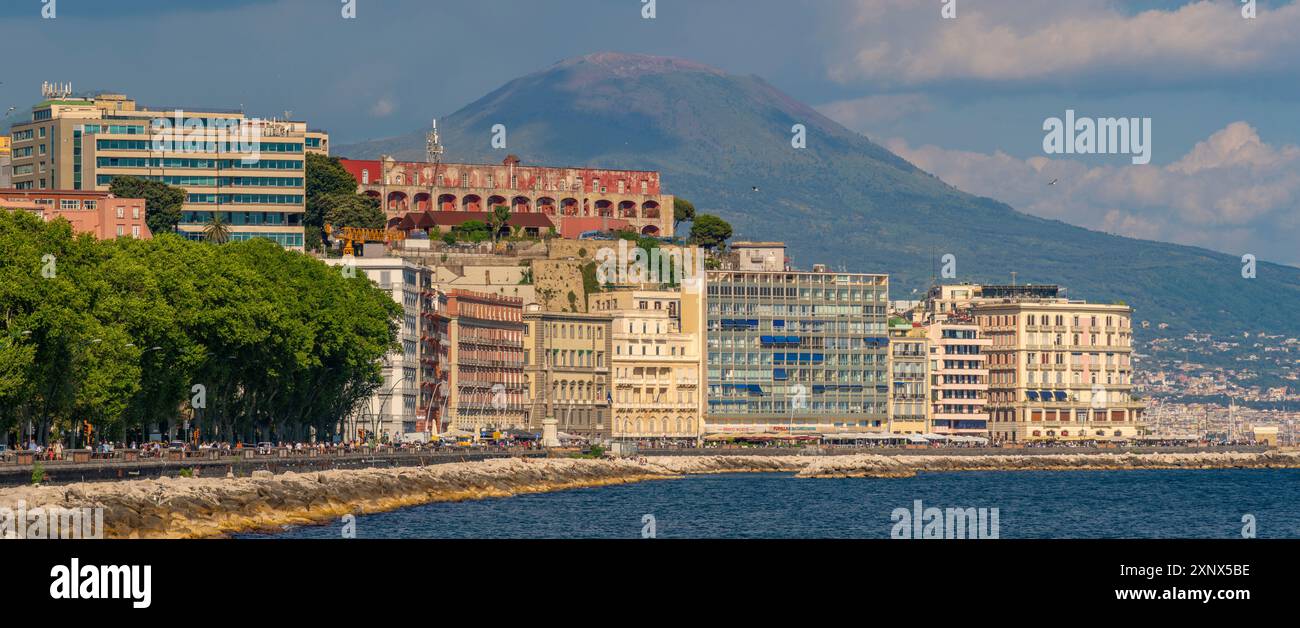 View of pastel coloured architecture, restaurants and cafes on seafront ...