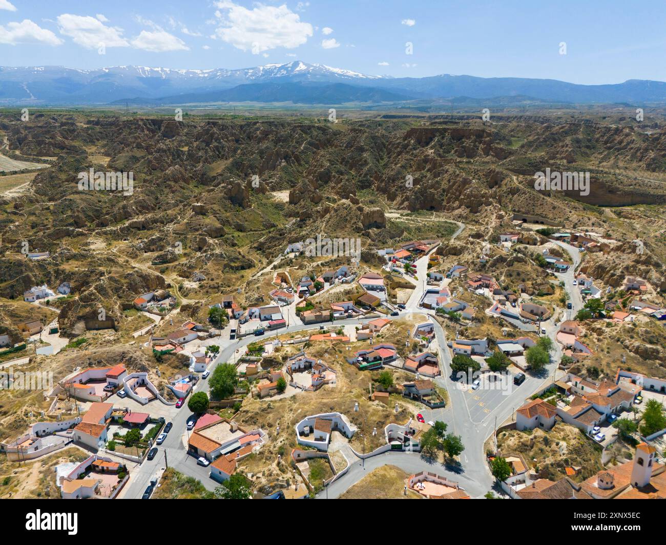Panoramic view of a village embedded in a rocky and hilly landscape ...