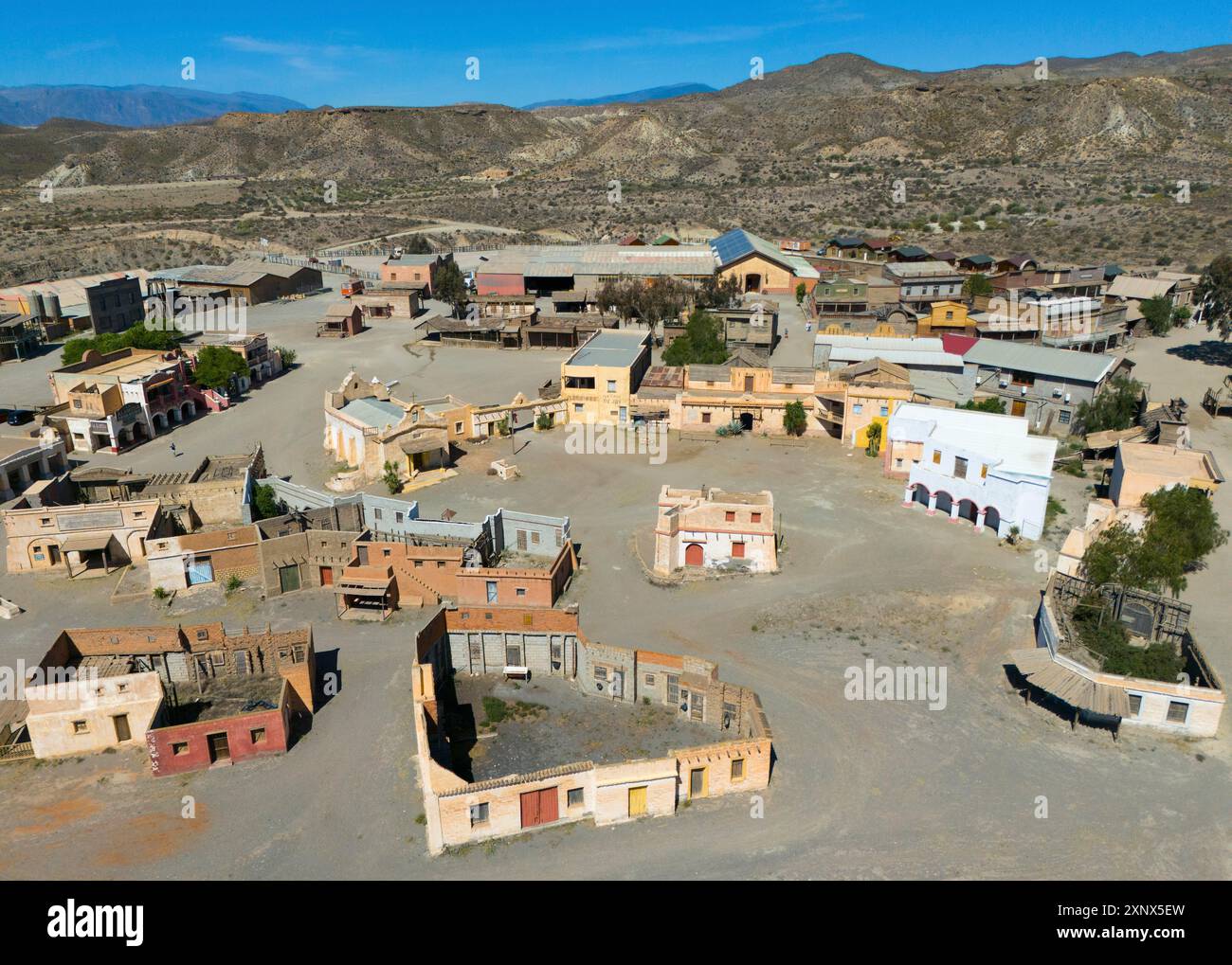 A historic western town with various buildings and empty streets in a ...