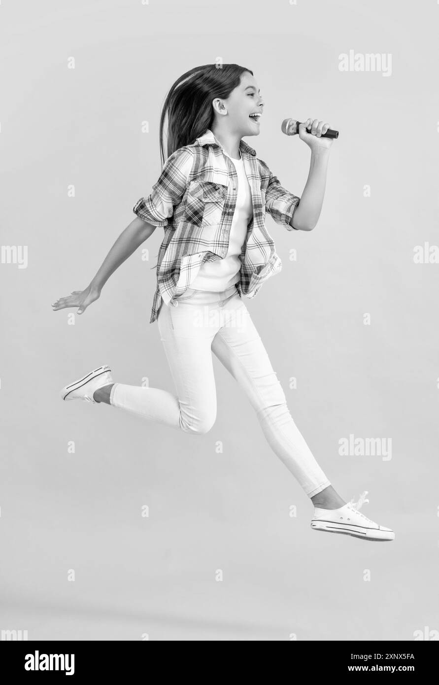 music lifestyle. sing a music song. young singer singing in mic. teen ...