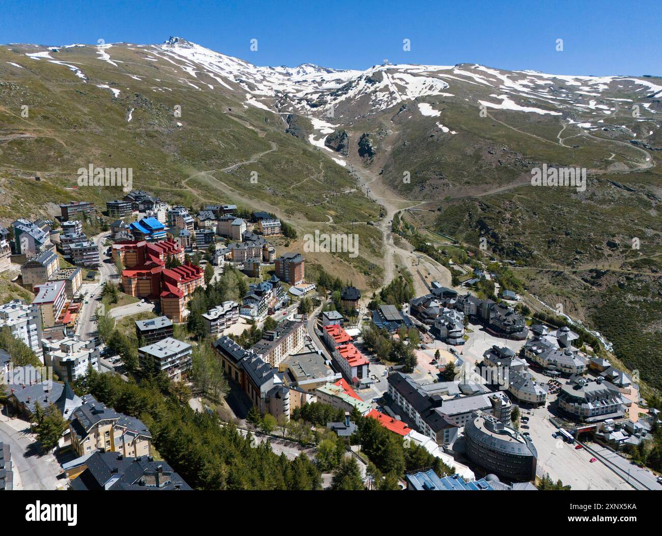 Aerial view of a mountain village with modern buildings in a snow ...