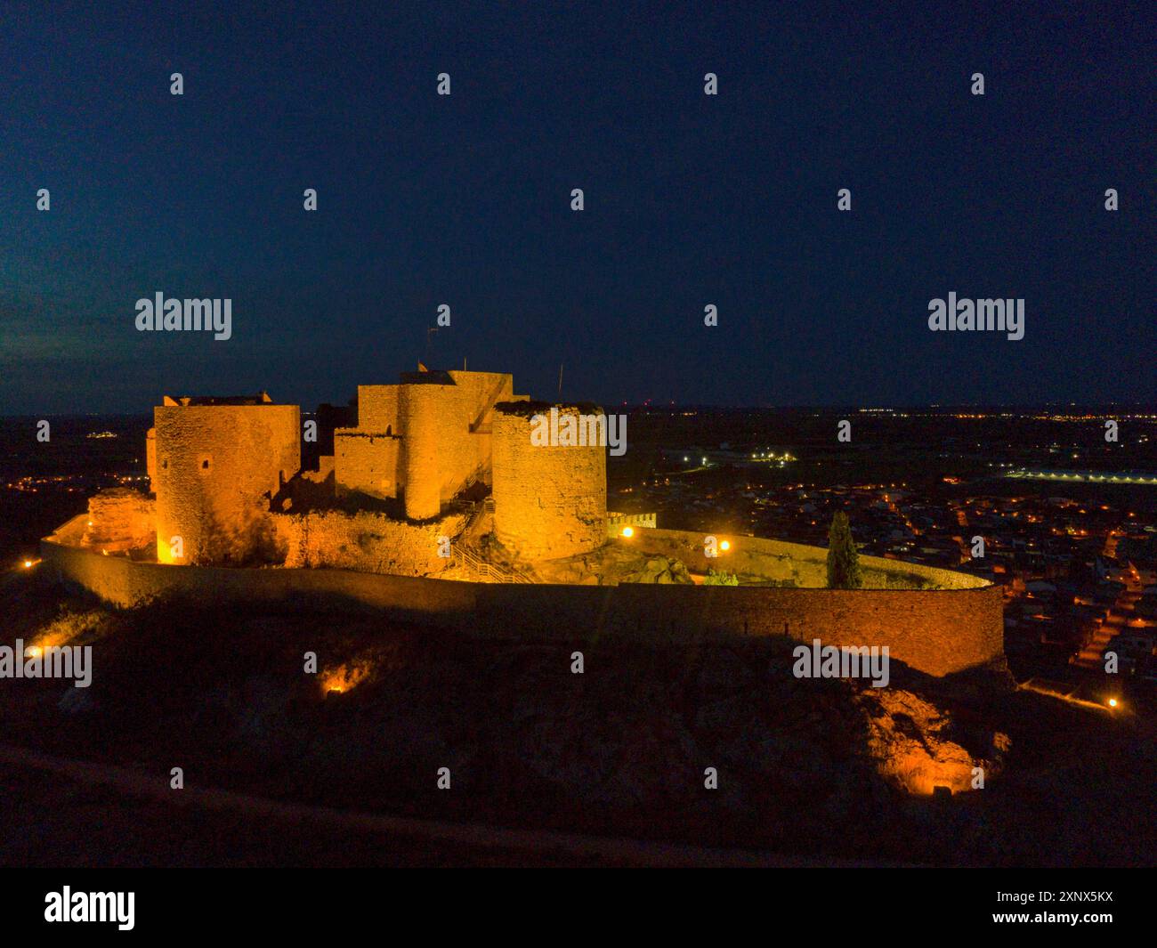 An illuminated castle at night with historical character and views of ...