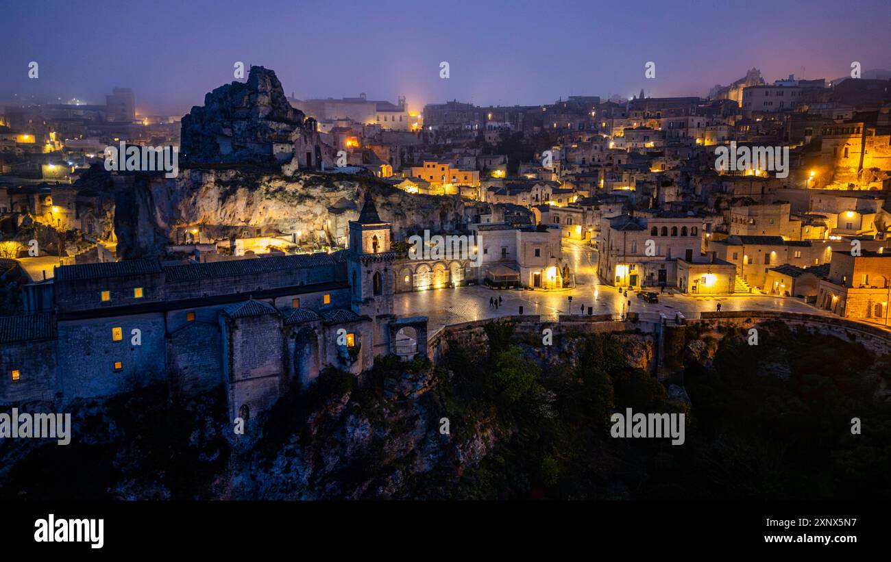 Aerial of Sassi di Matera at night, UNESCO World Heritage Site ...