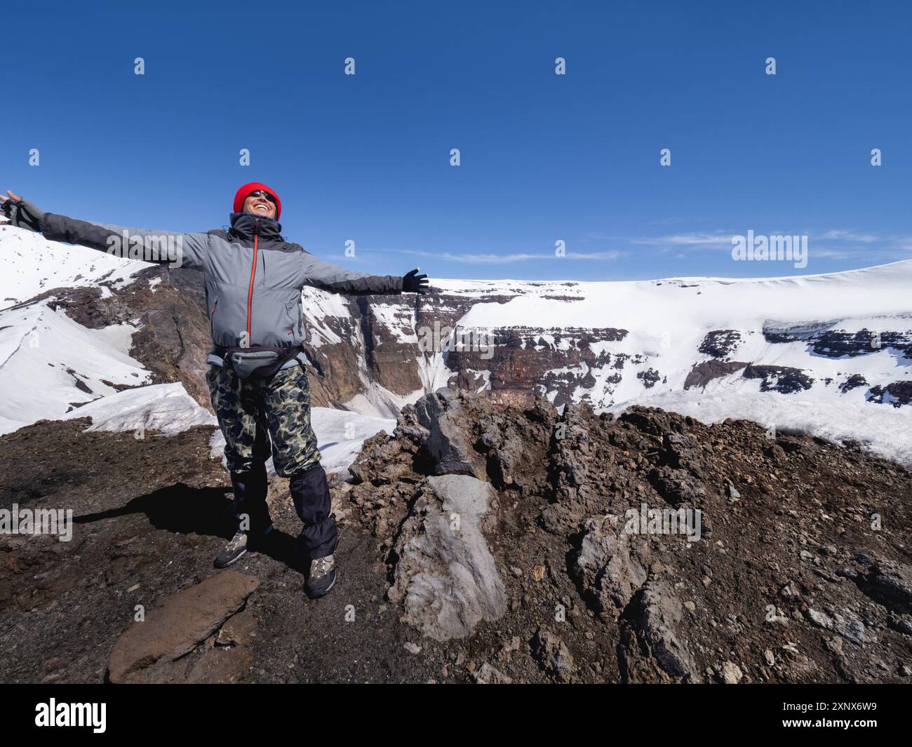 Happy tourist makes selfie on Plosky Tolbachik stratovolcano. Natural ...