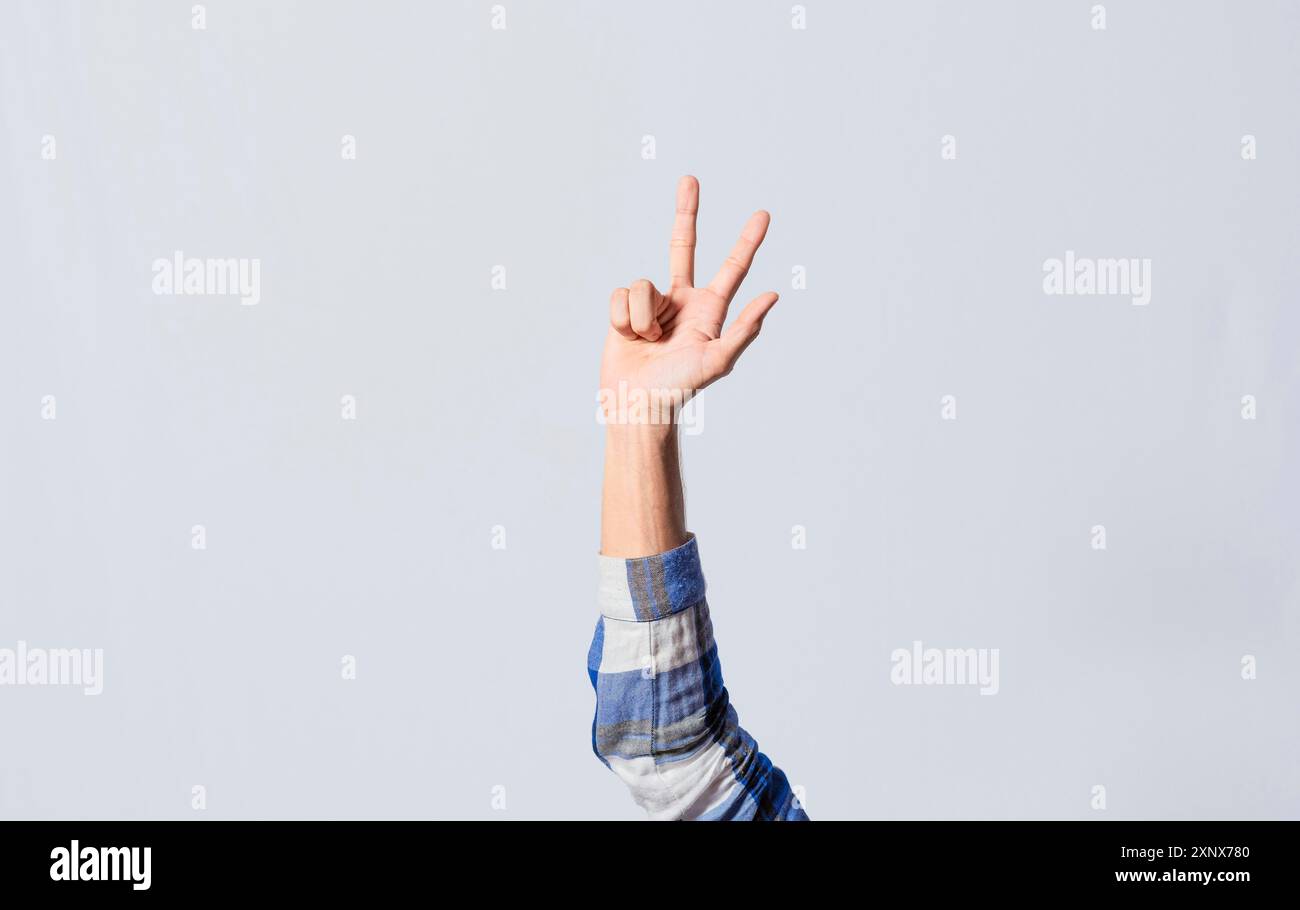 Number THREE in sign language. Fingers counting the number THREE in ...