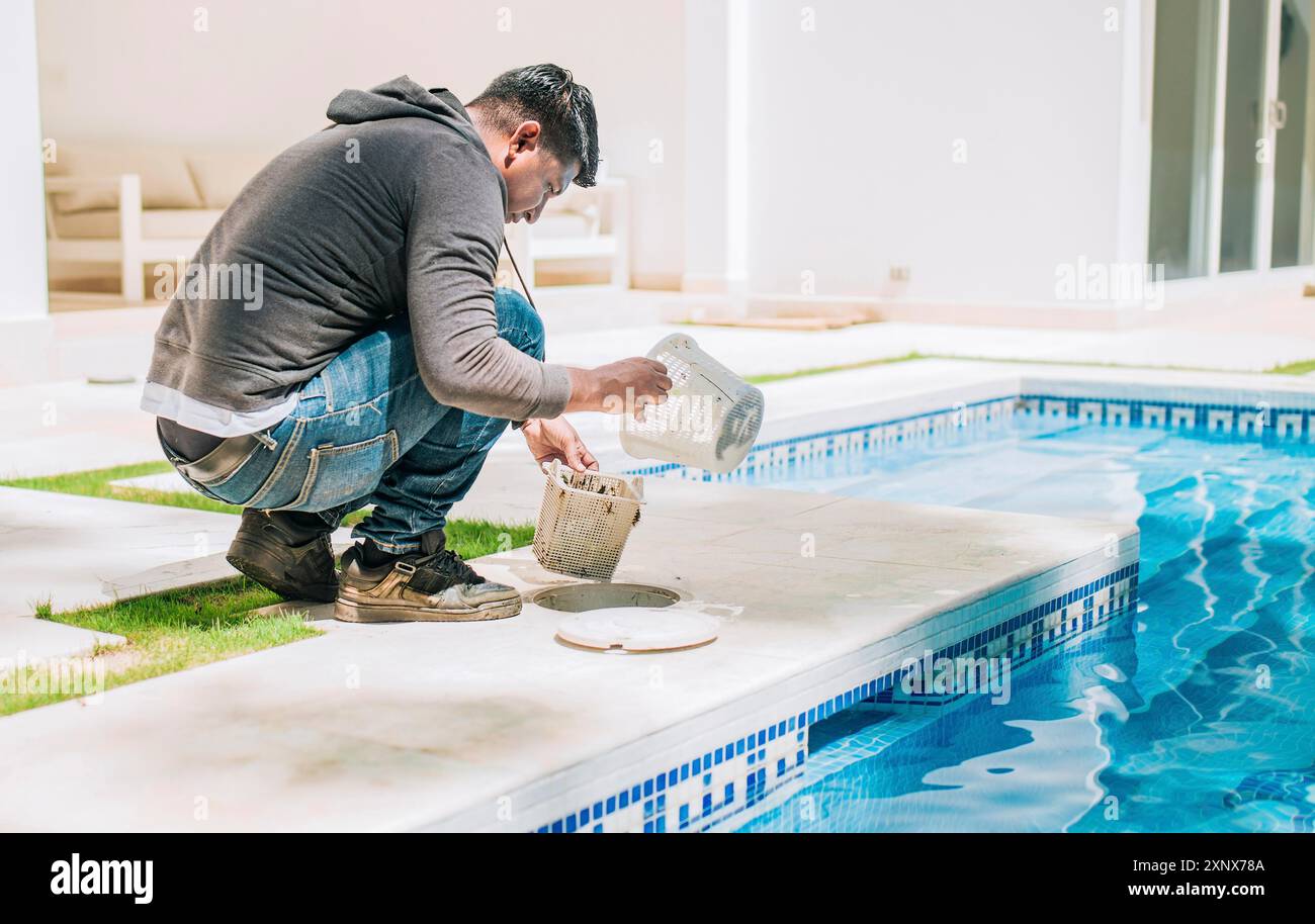 Person cleaning garbage filter basket for swimming pool. Man cleaning ...