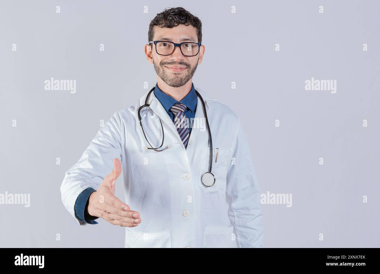 Smiling doctor shaking hands in welcome sign isolated. Friendly male ...