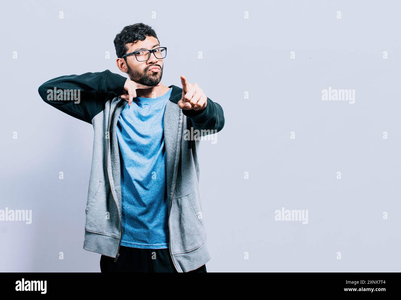 Person threatening with the finger in the throat isolated. Man with a ...