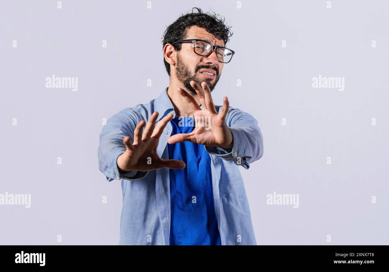Young man with rejection expression isolated. Man with scared ...