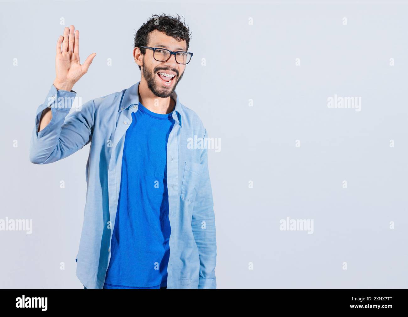 Handsome man gesturing and saying hi isolated. friendly person saying ...