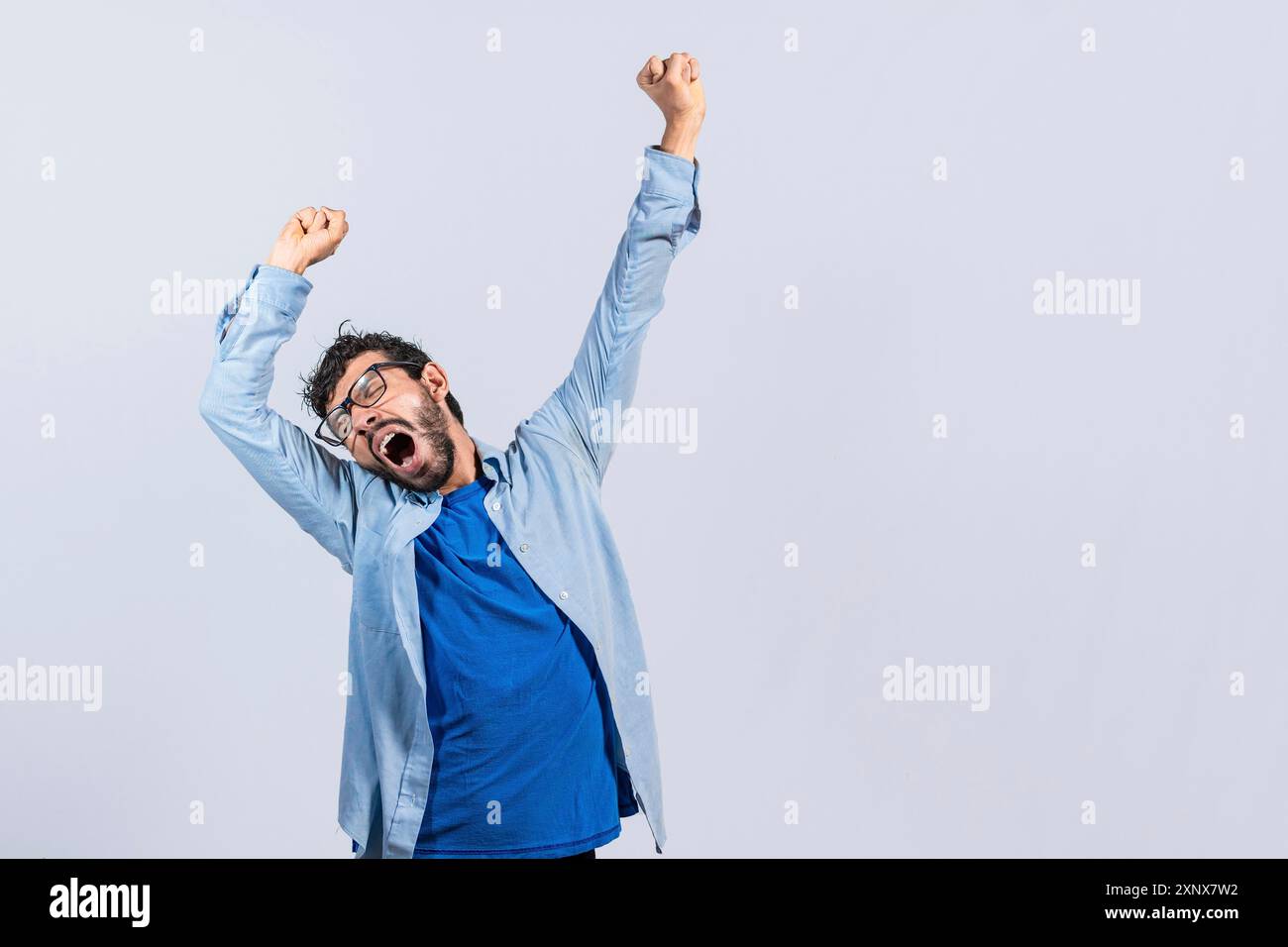 Beard man yawning and stretching his hands isolated. Sleepy man ...