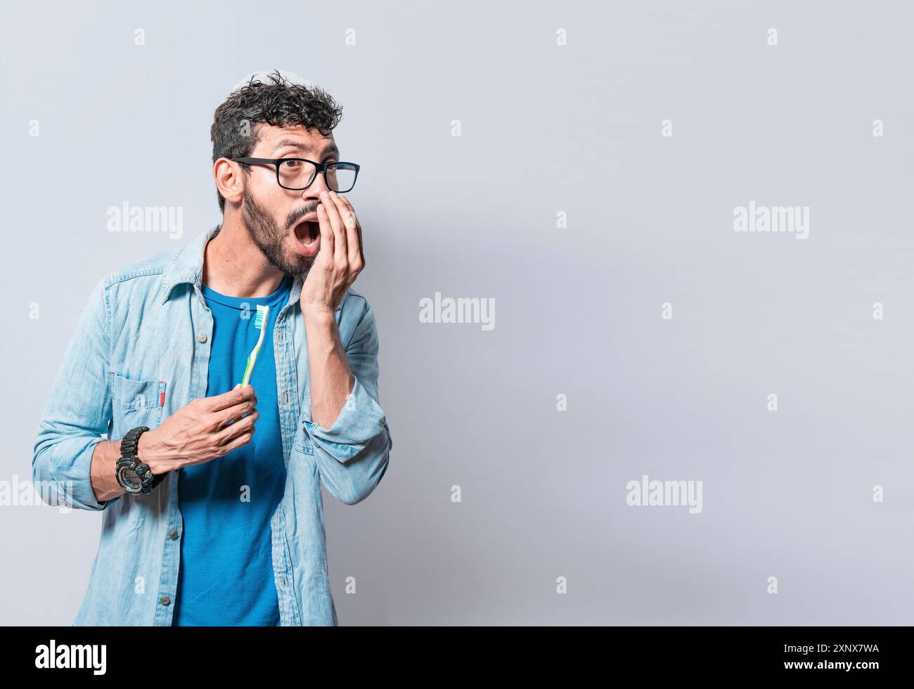 Person with brush with bad breath problem, Man with brush and bad ...