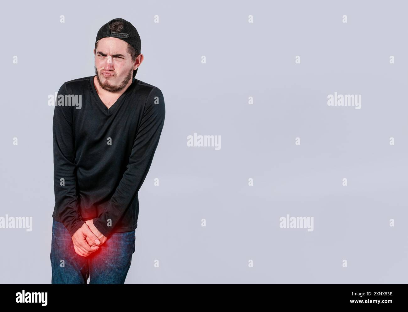 Medical problem, urinary incontinence concept. Young man with crotch ...