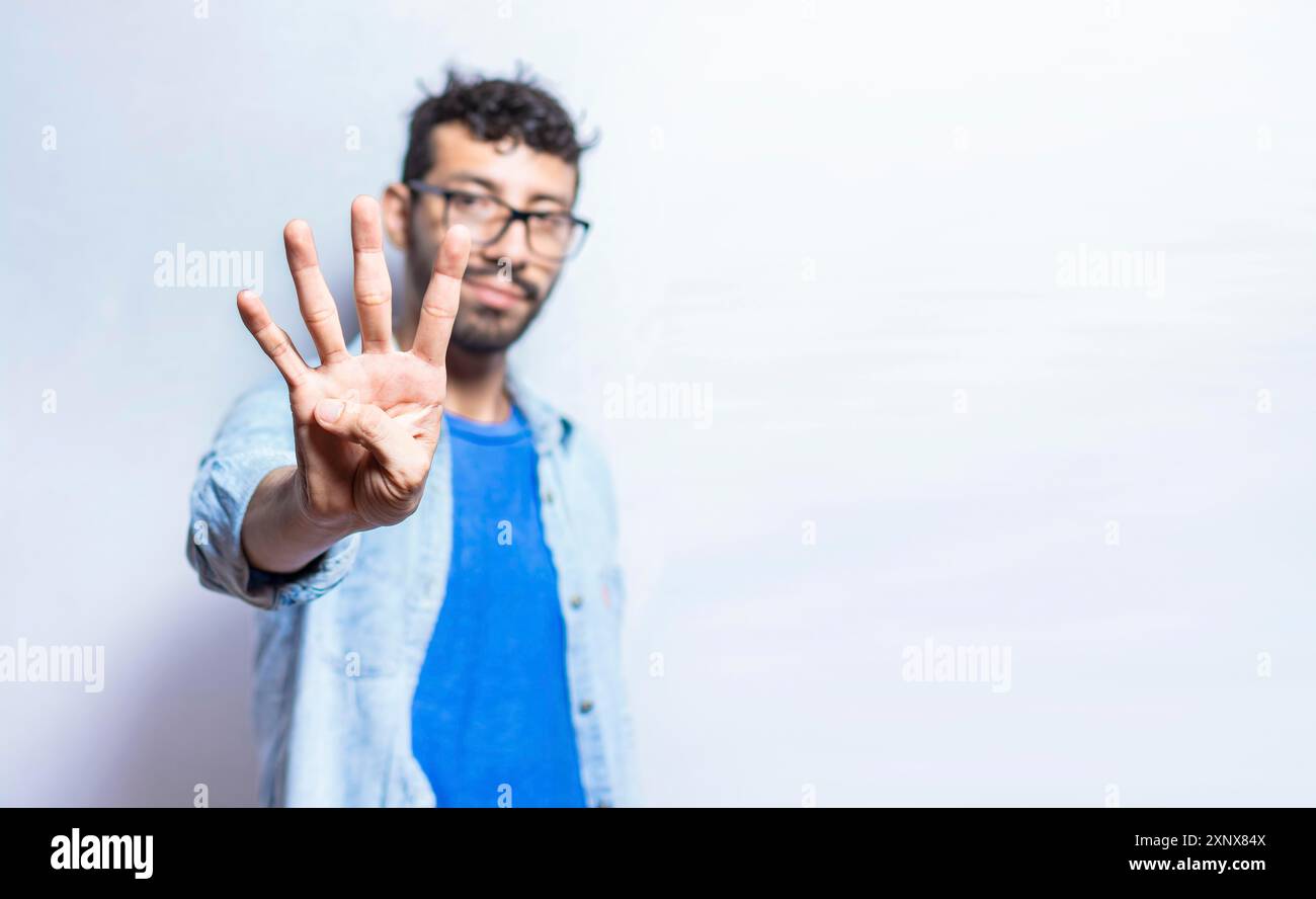 Portrait of people counting number four on isolated background. Person ...