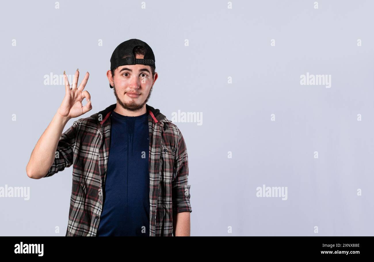 Young man making ok gesture, expression of everything is fine, Concept ...