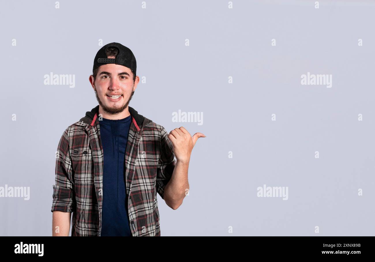 Cheerful bearded man with a friendly smile shows you the direction to a ...
