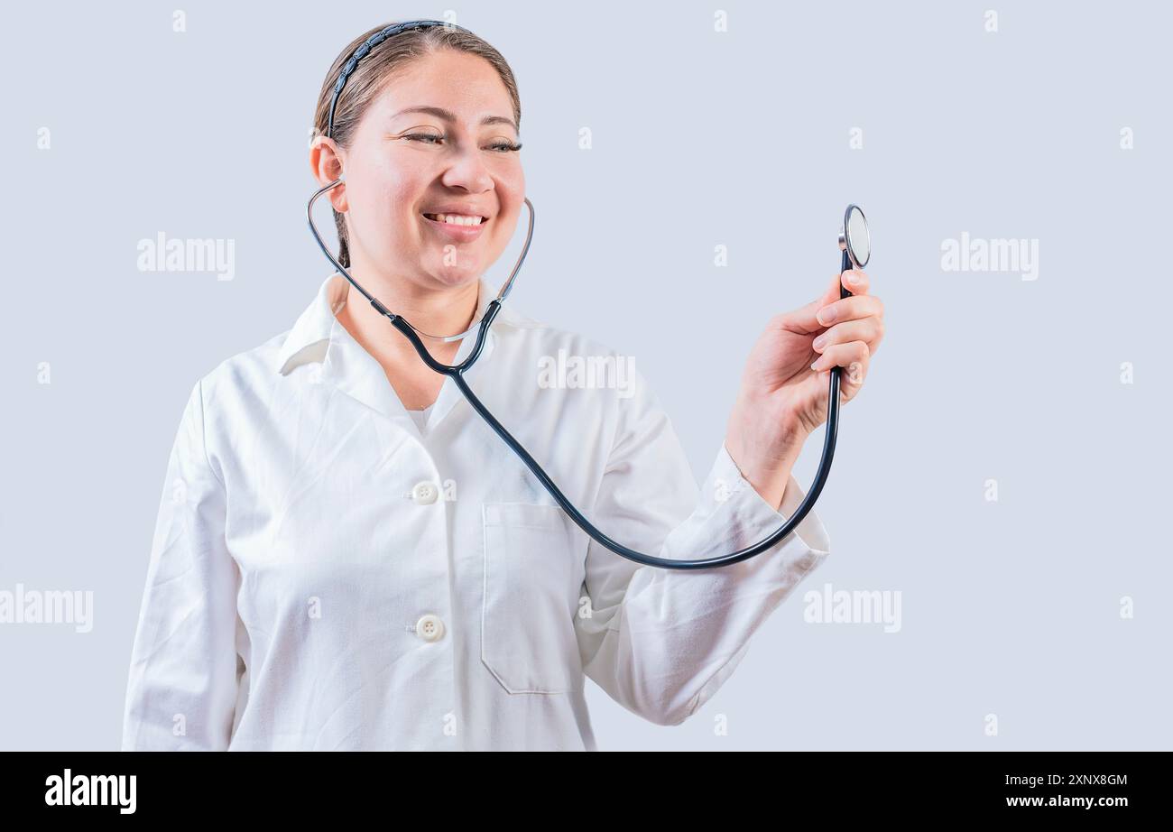 Smiling female doctor hand holding stethoscope isolated. Young female ...
