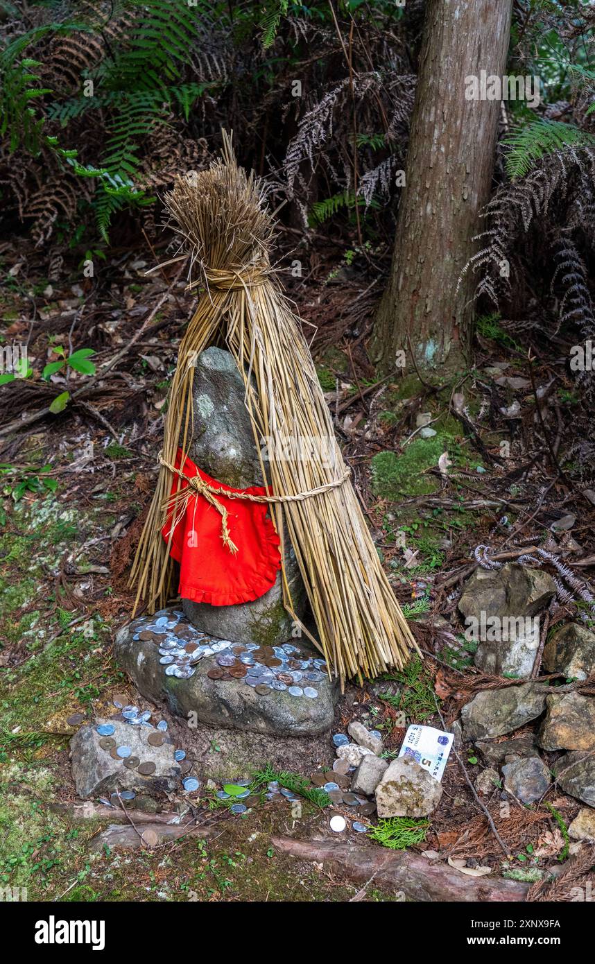 Small shrine with money offerings along the Kumano Kodo ancient ...