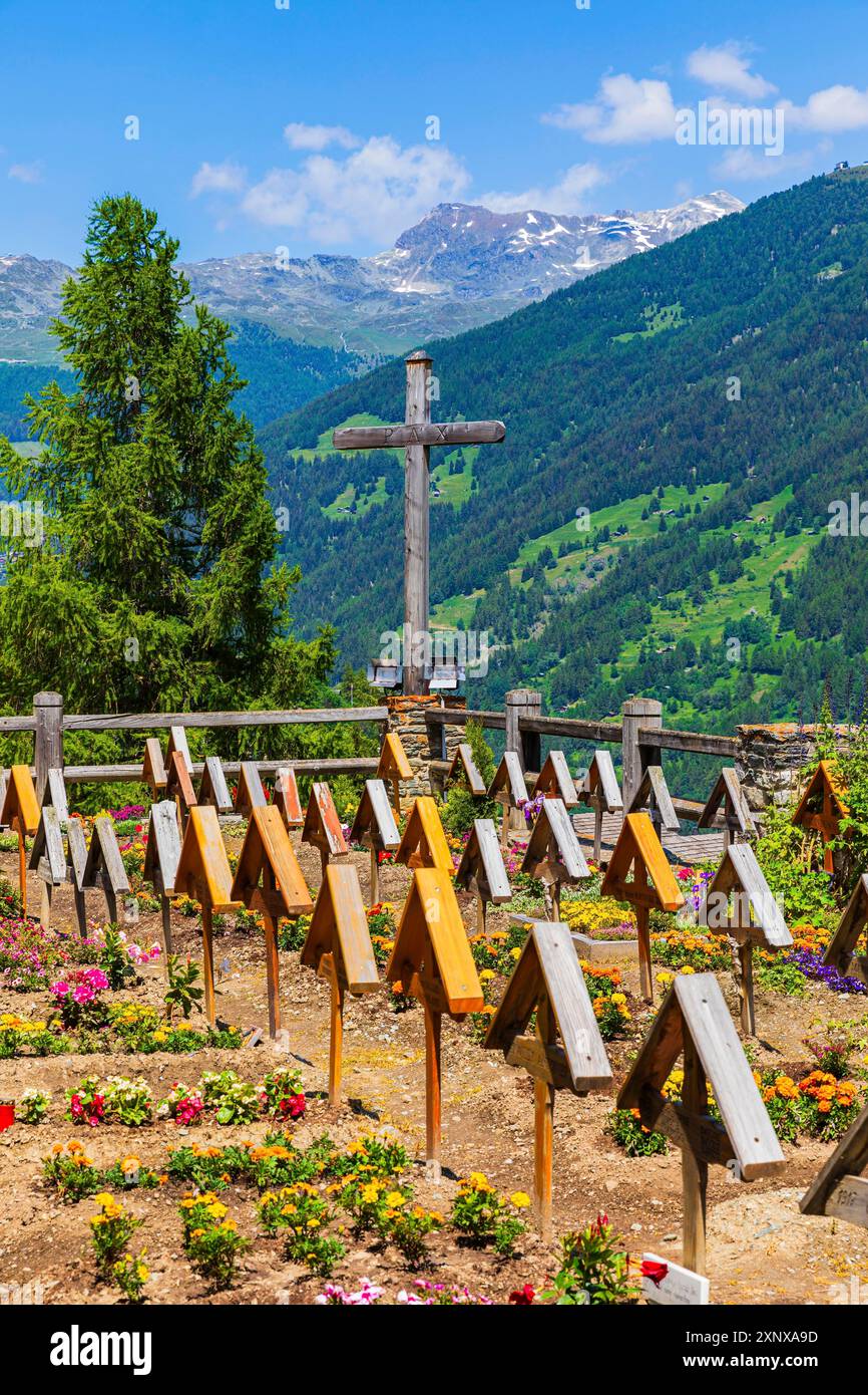 Cemetery with large wooden cross and simple grave crosses, historic ...