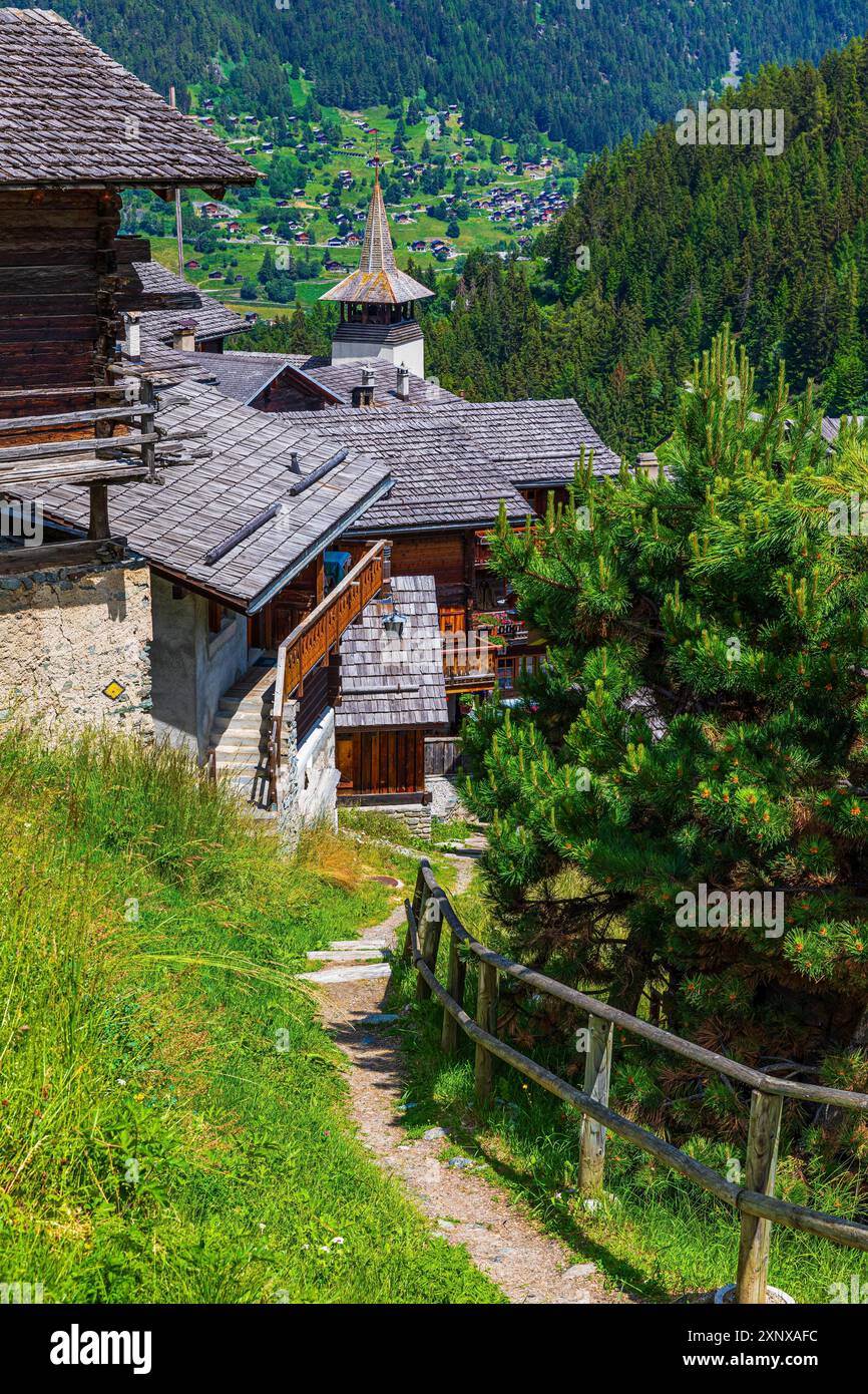 Hiking trail through the historic village centre, behind the Saint ...