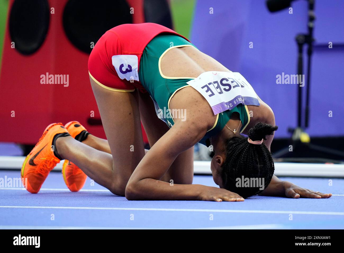 Worknesh Mesele, of Ethiopia, reacts after winning a heat in the women ...