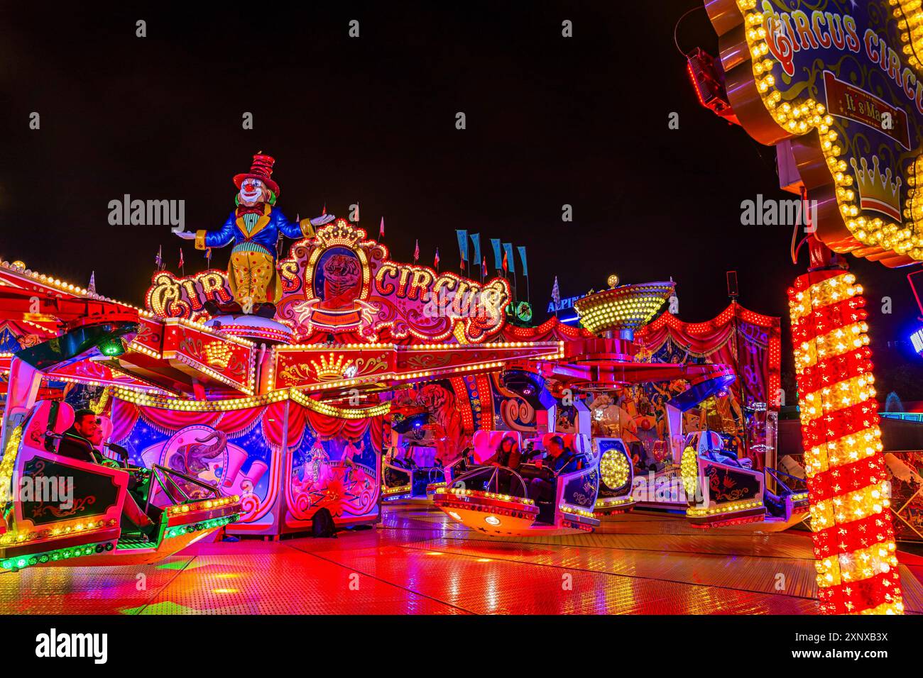 Illuminated round and elevated ride Circus Circus at standstill, night ...