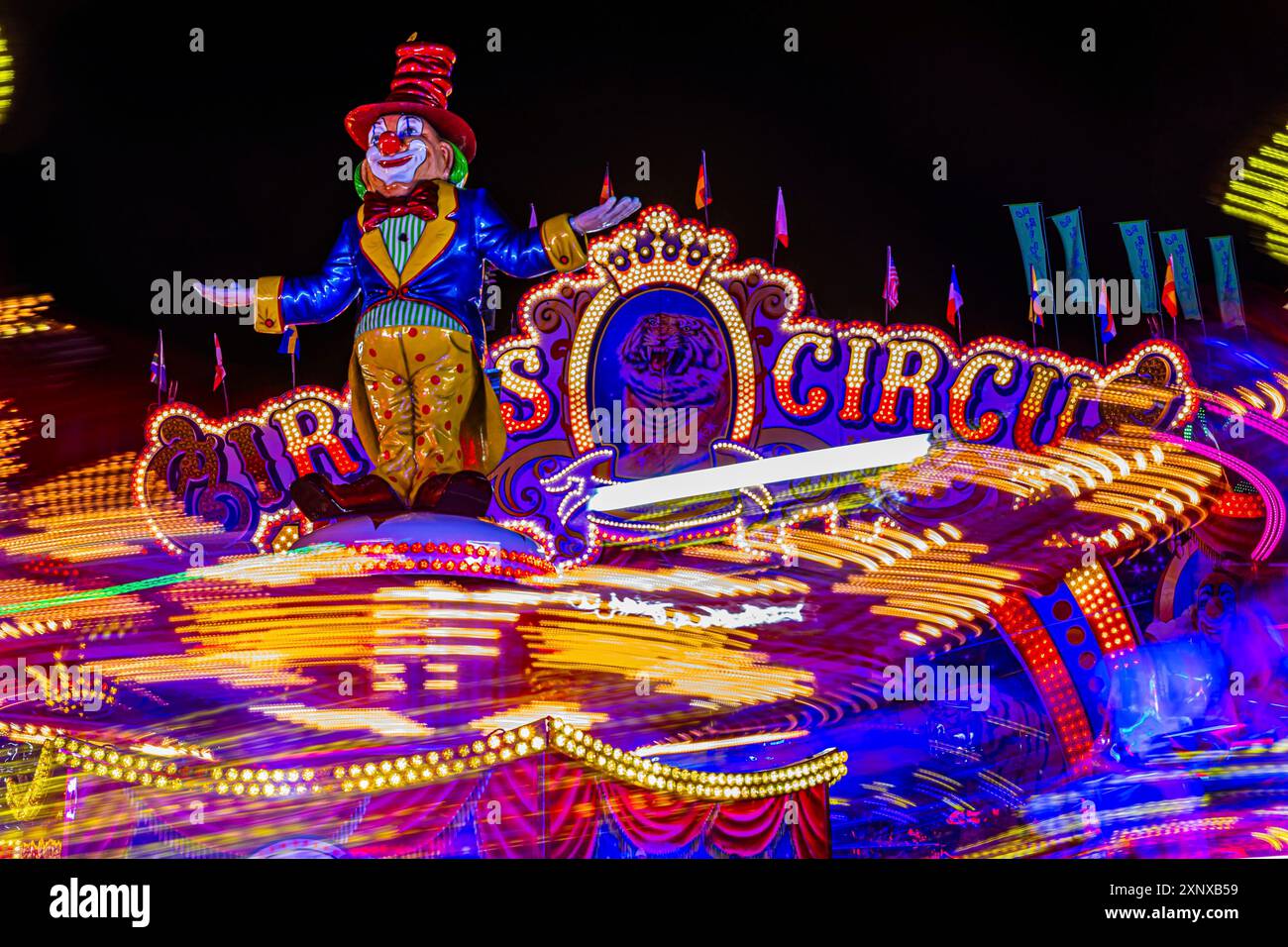 Illuminated round and elevated ride Circus Circus gondolas in motion ...