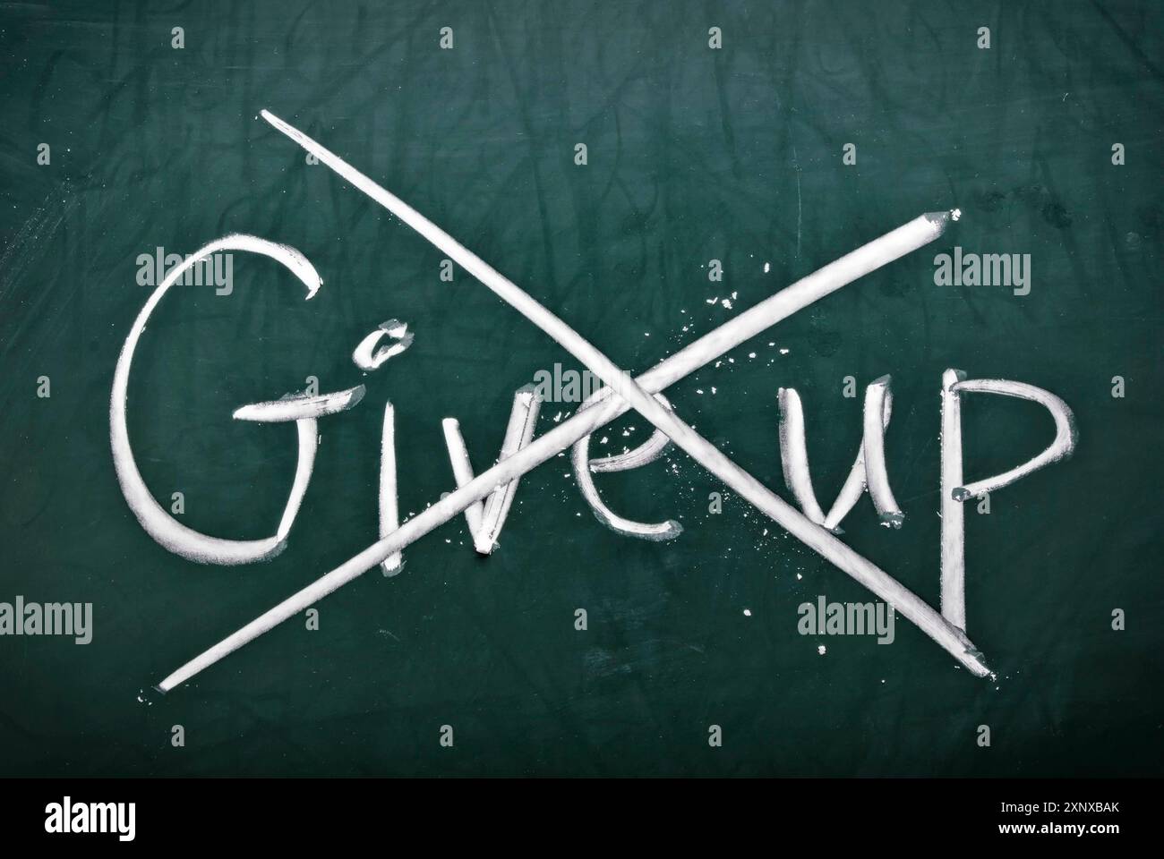 Do not give up, words on blackboard Stock Photo - Alamy