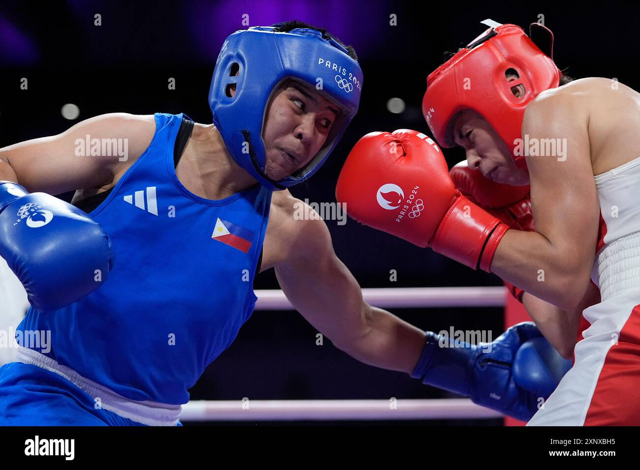 Philippines' Nesthy Petecio hits France's Amina Zidani in their women's ...