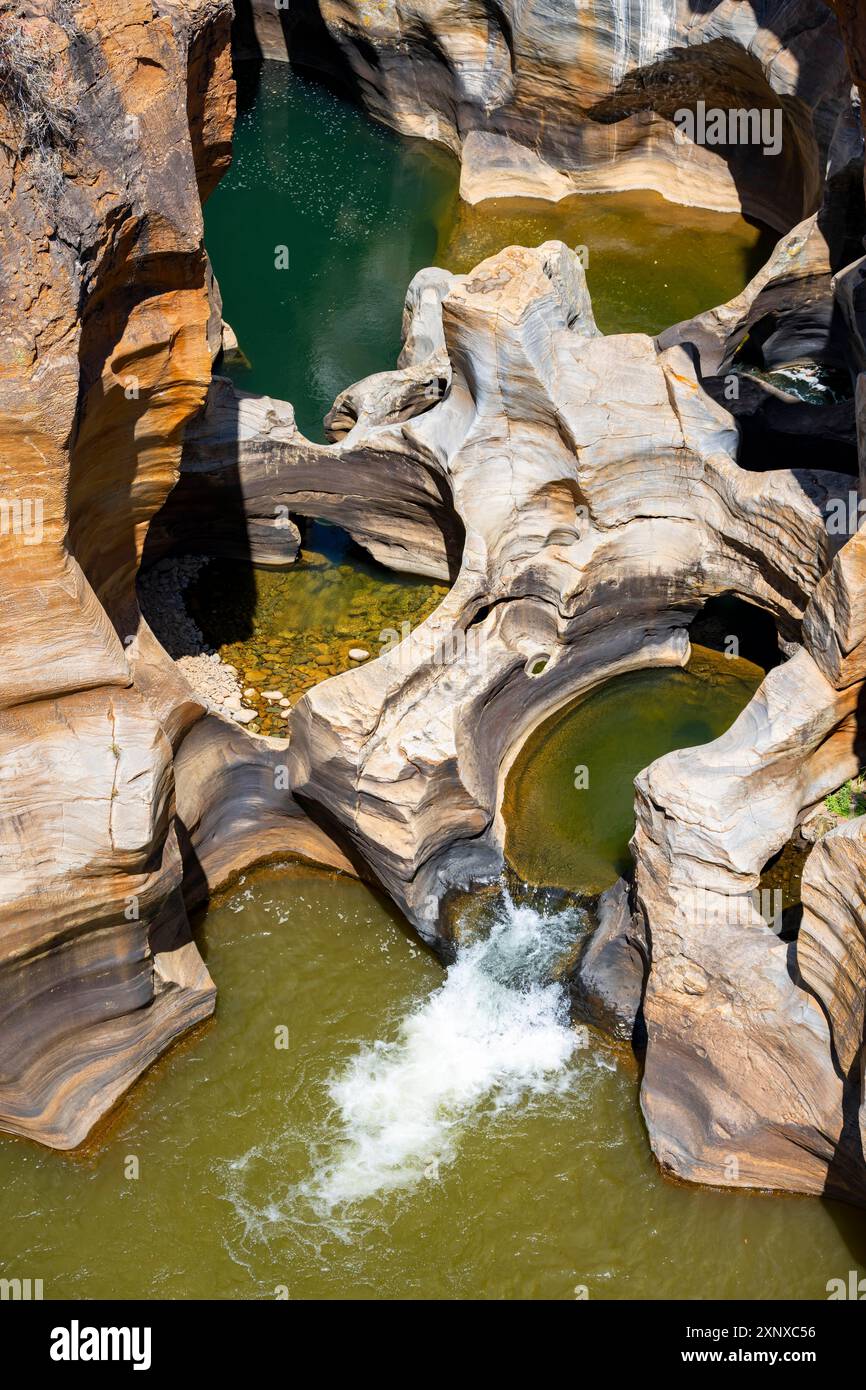 Eroded rock formations, canyon with steep orange-coloured rock cliffs ...