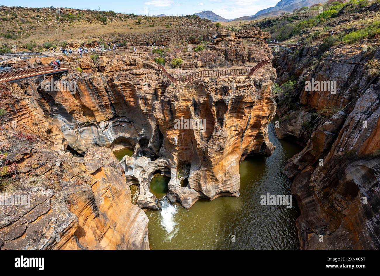 Bridges over a canyon with steep orange-coloured cliffs and the Blyde ...