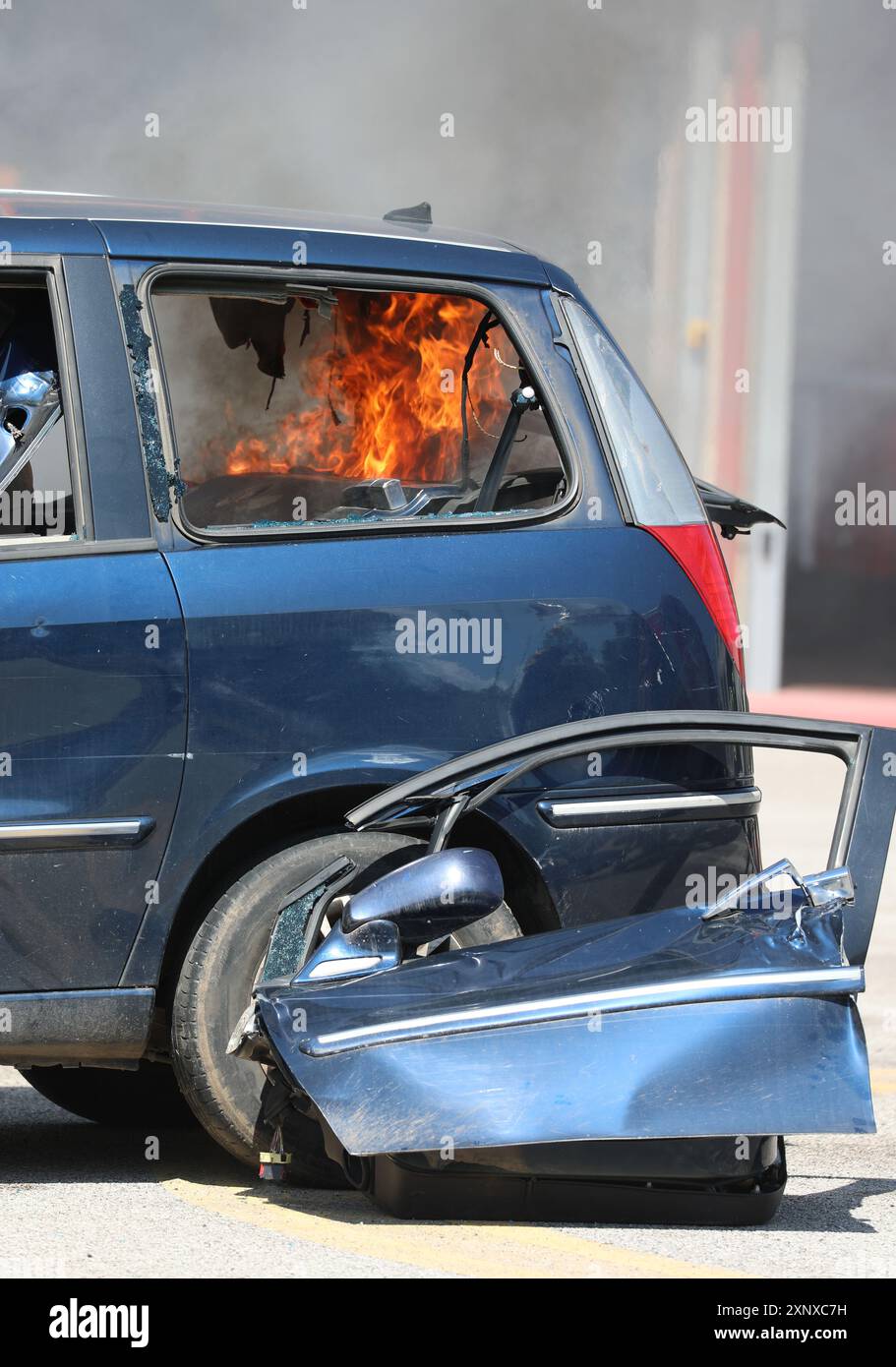 Car trunk engulfed in flames following a fatal traffic collision ...