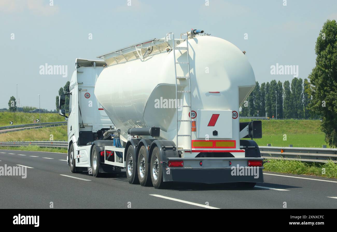 Large fuel tanker truck hauling flammable liquid on a highway Stock ...