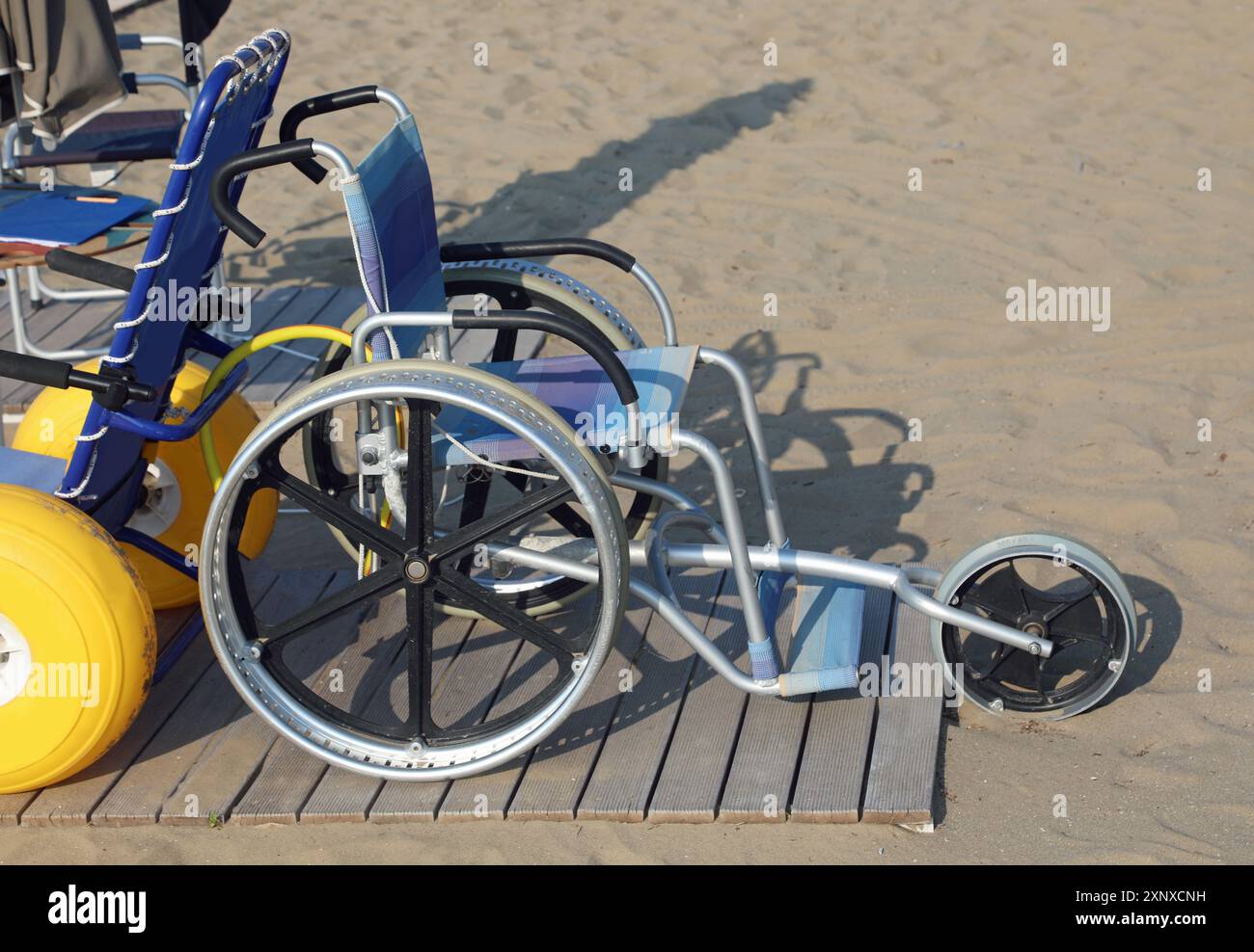 Special wheelchair with large steel wheels for transporting disabled ...