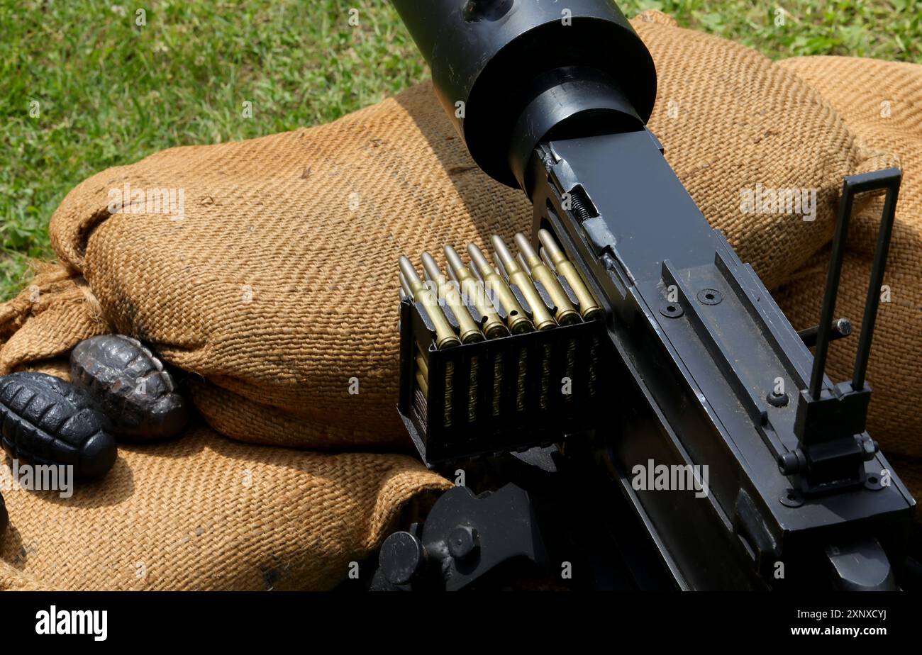 historic automatic machine gun of World War I and many bullets on ...