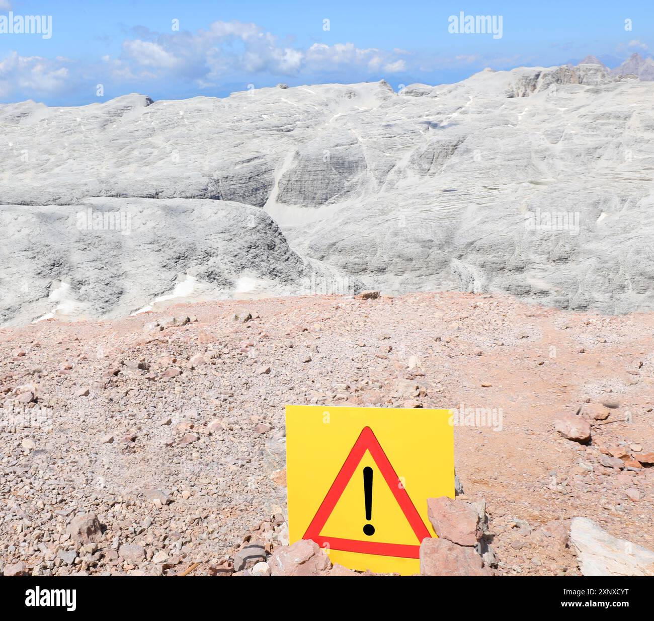 Warning sign with an exclamation point preceding a dangerous cliff on ...