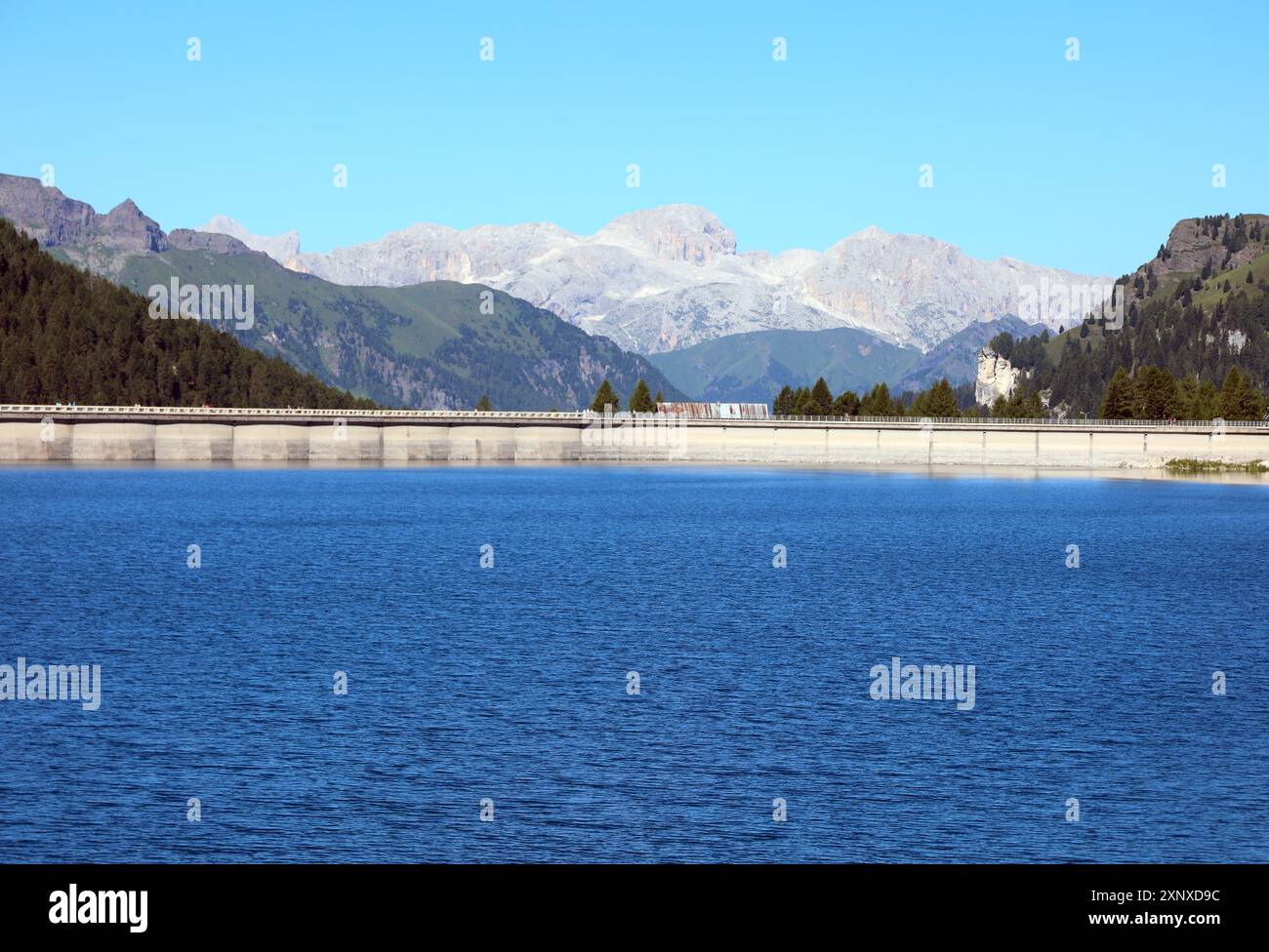 concrete dam of the artificial lake named Lago di Fedaia in Northern ...