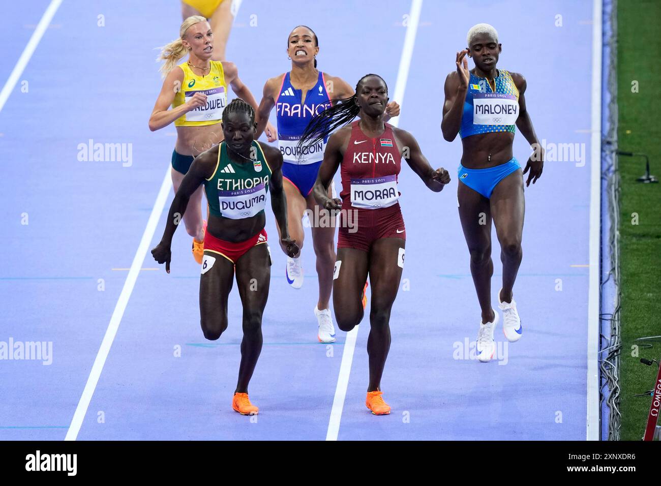 Tsige Duguma, of Ethiopia, wins a heat ahead of Mary Moraa, of Kenya ...