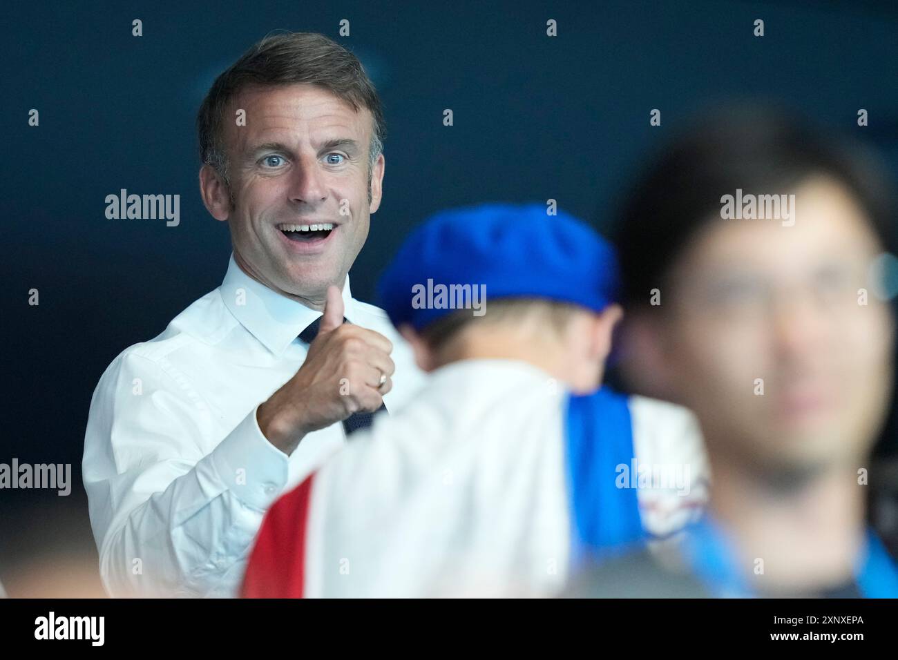 French President Emmanuel Macron gestures to the crowd as he arrives at ...