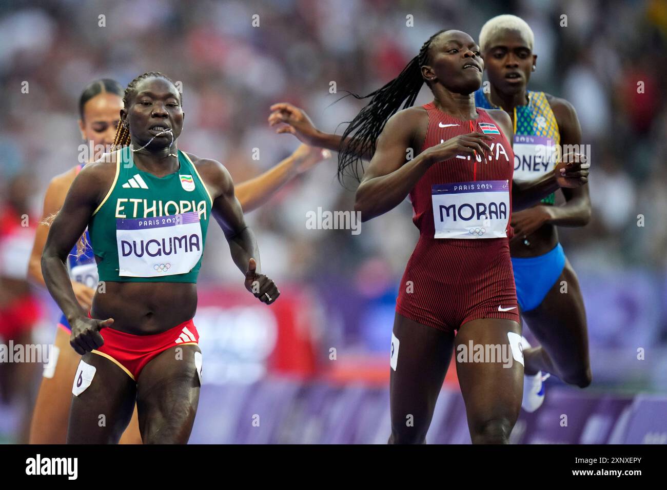 Tsige Duguma, of Ethiopia, wins a heat ahead of Mary Moraa, of Kenya ...
