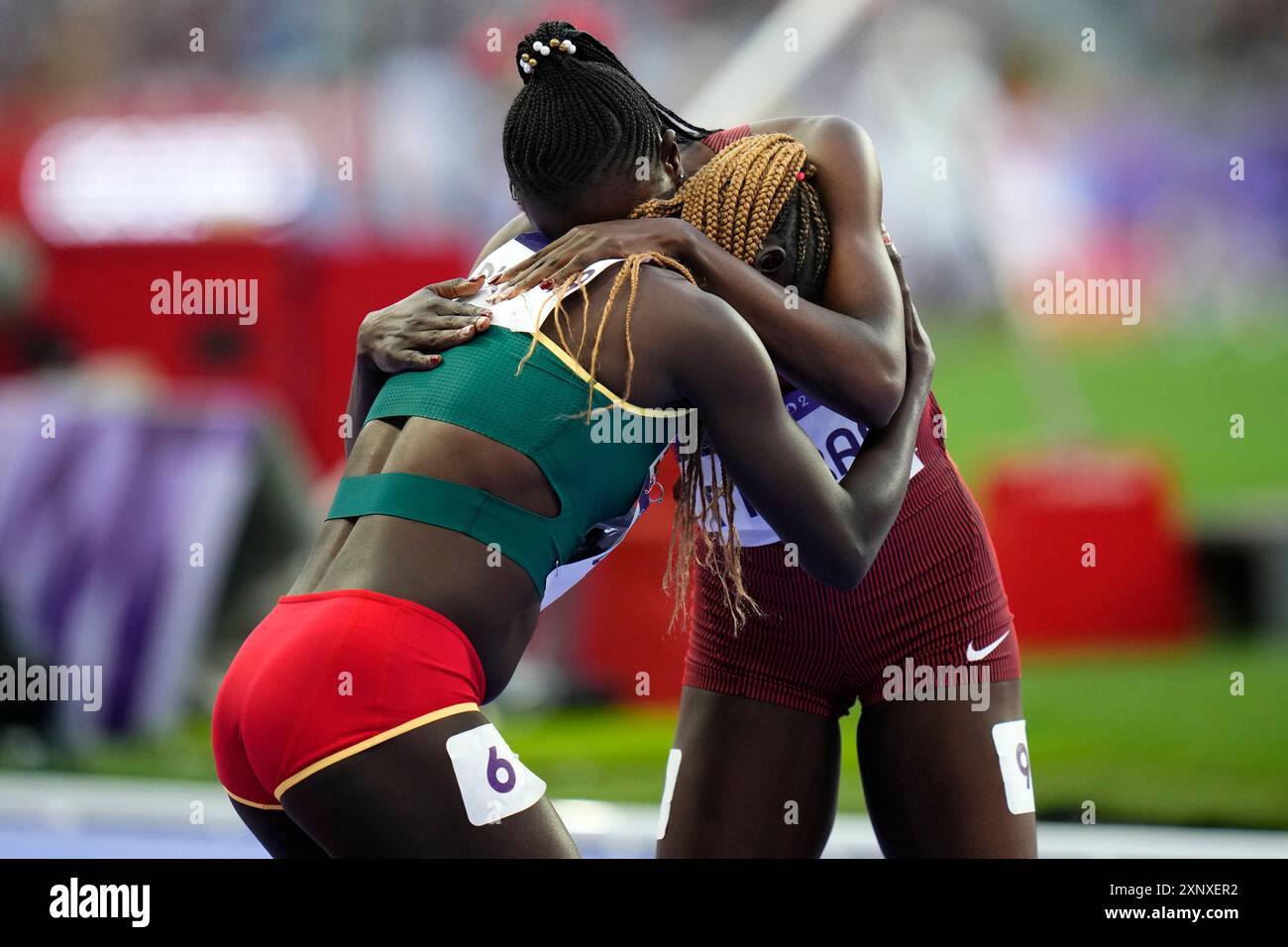 Tsige Duguma, of Ethiopia, left, hugs Mary Moraa, of Kenya, after a ...