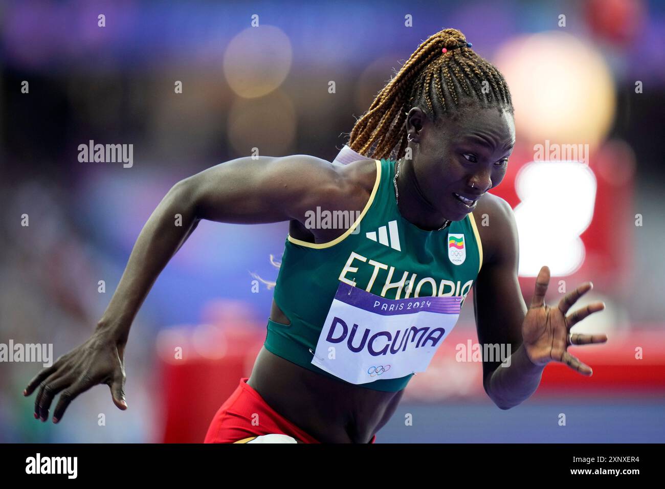 Tsige Duguma, of Ethiopia, wins a heat in the women's 800-meter run at ...