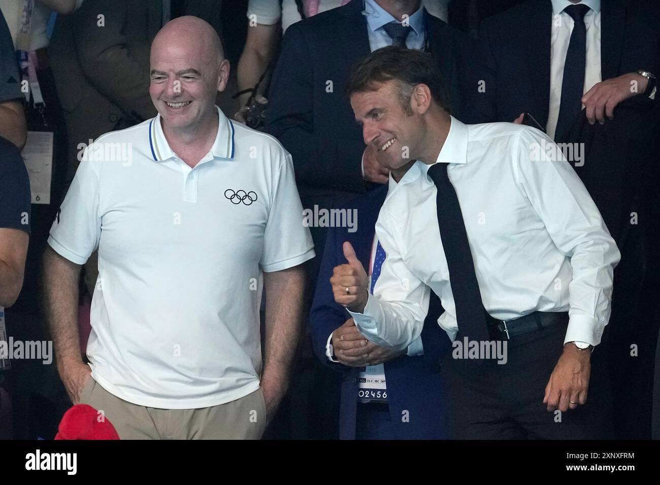French President Emmanuel Macron waves to the crowd as stands with FIFA ...